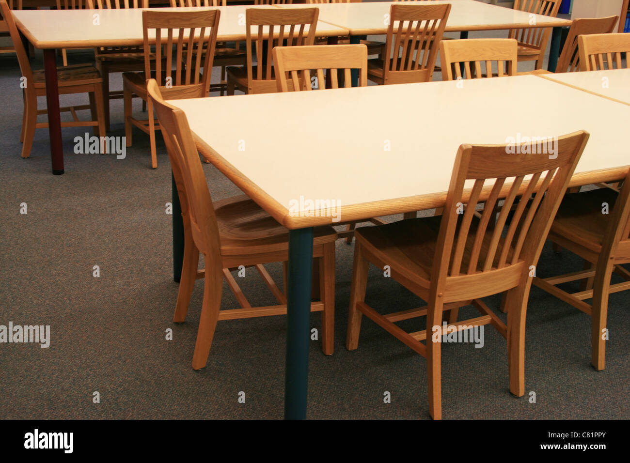 tables and wooden chairs in a library Stock Photo - Alamy