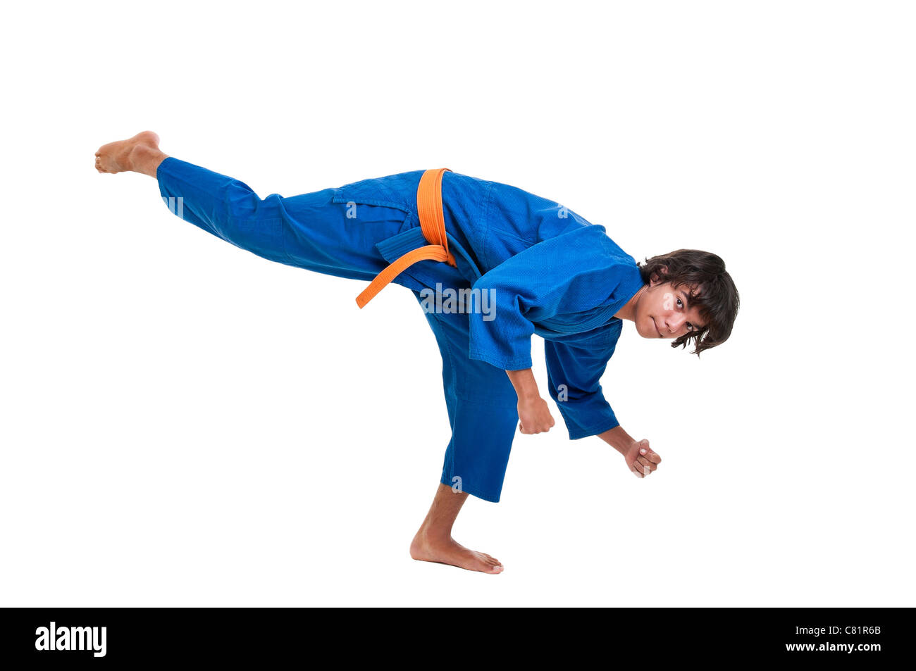 Young fighter posing against a white background Stock Photo - Alamy