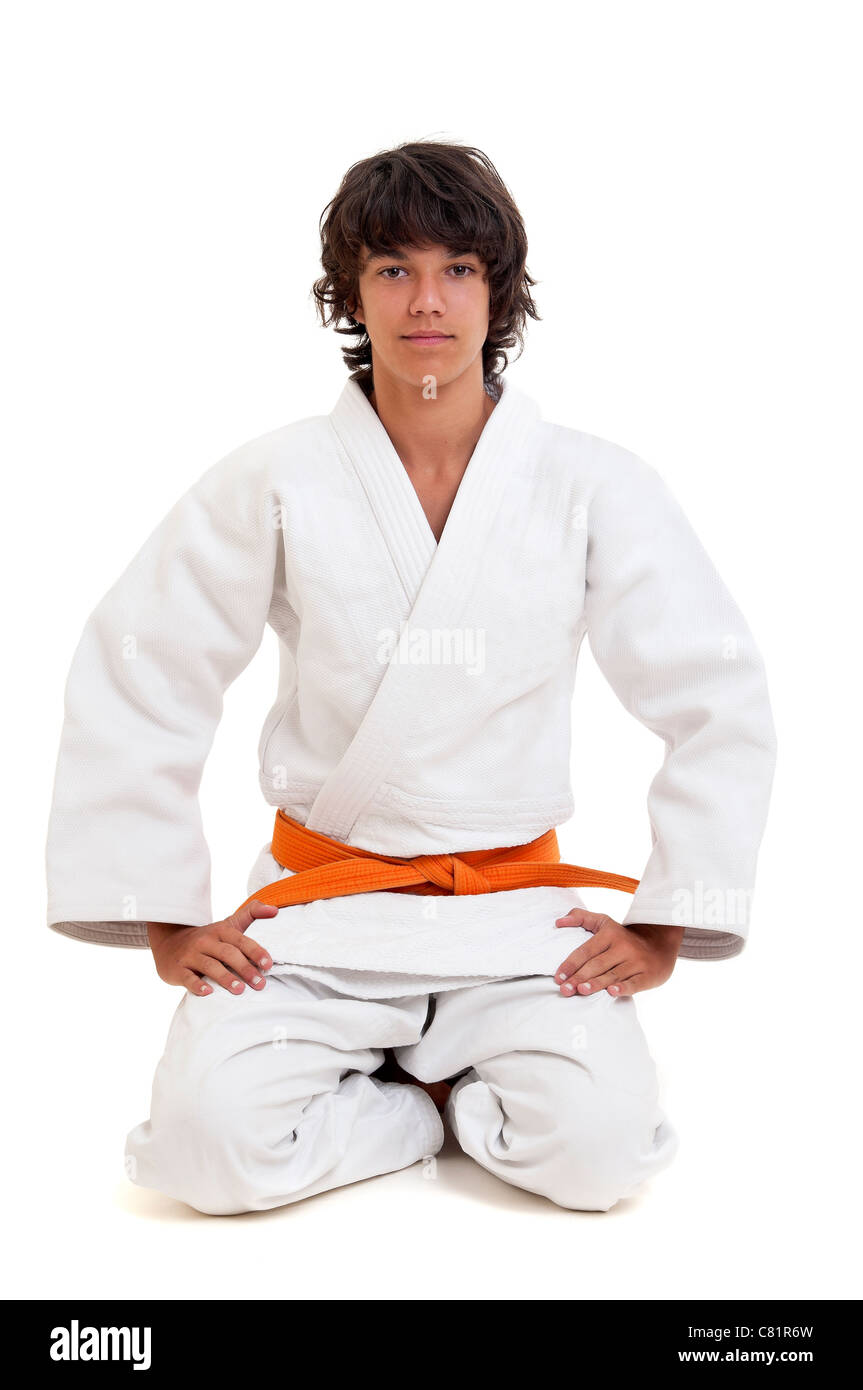Young fighter posing against a white background Stock Photo - Alamy