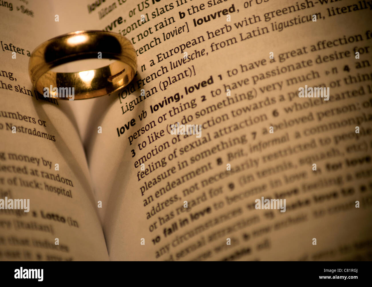 A wedding ring with a shadowed heart and description of 'love' Stock ...
