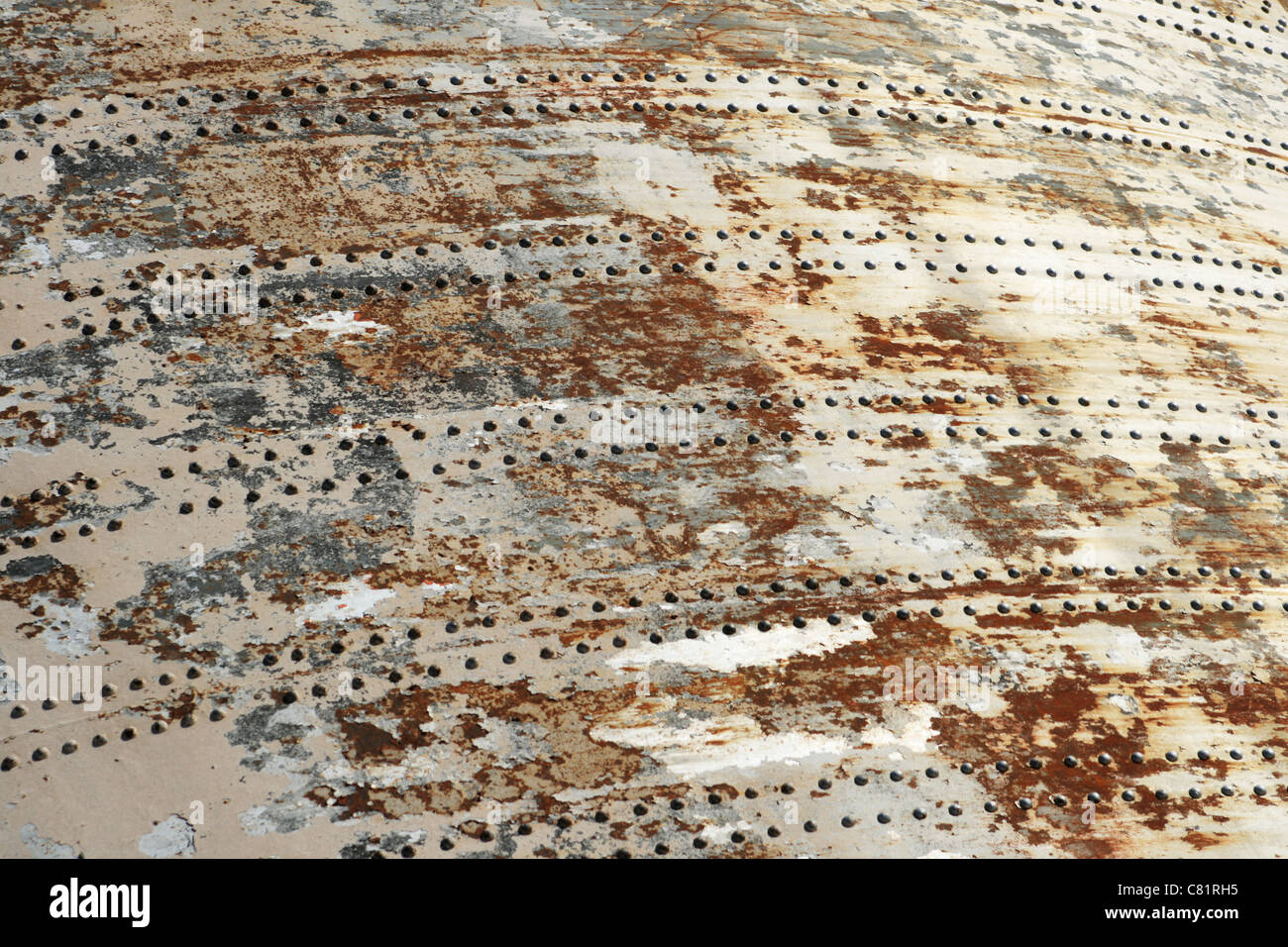 flaking painted rusty metal background with rivet lines from dam ...