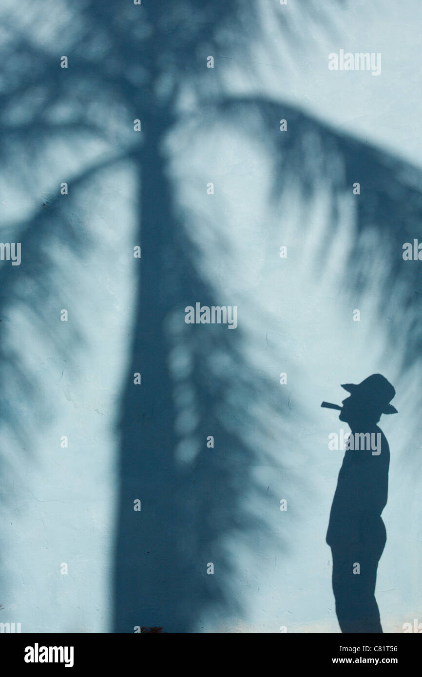 TRINIDAD: SHADOW OF CUBAN MAN SMOKING CIGAR Stock Photo - Alamy