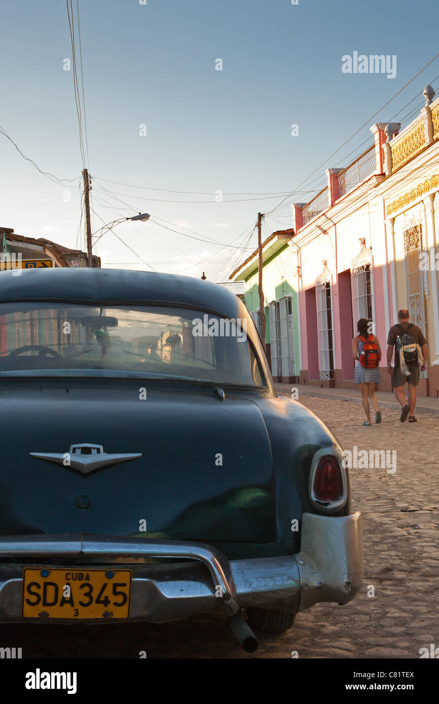 TRINIDAD: STREET SCENE WITH VINTAGE CAR AND TOURISTS Stock Photo - Alamy