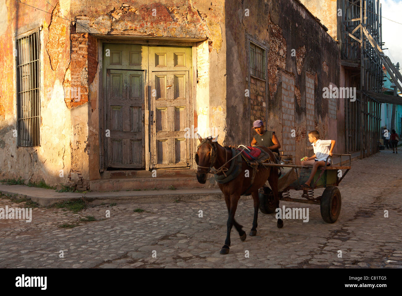 TRINIDAD: STREET SCENE WITH MAN AND BOY RIDING HORSE AND CART Stock ...