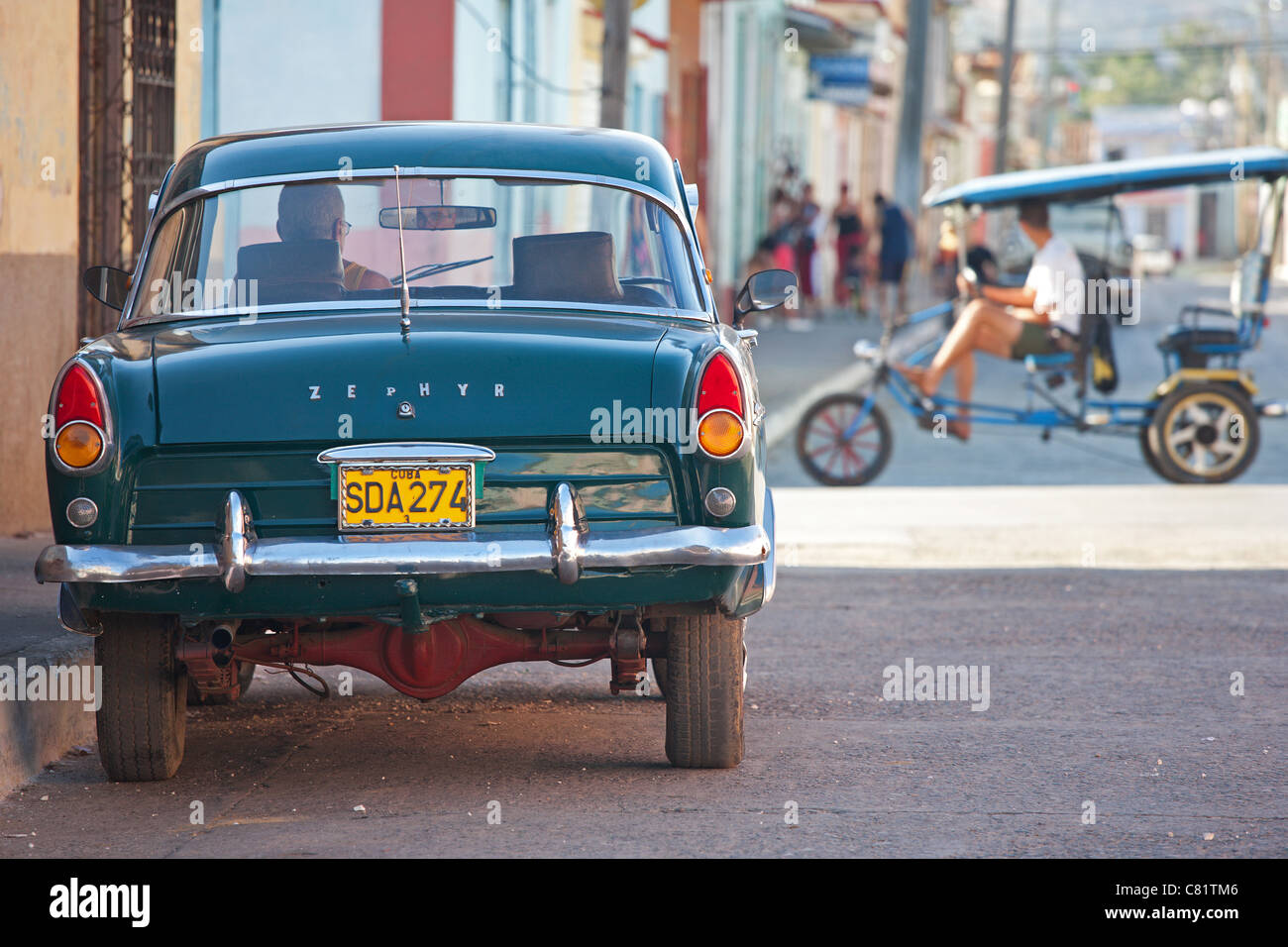 TRINIDAD: STREET SCENE WITH CAR AND BICYCLE RICKSHAW Stock Photo - Alamy