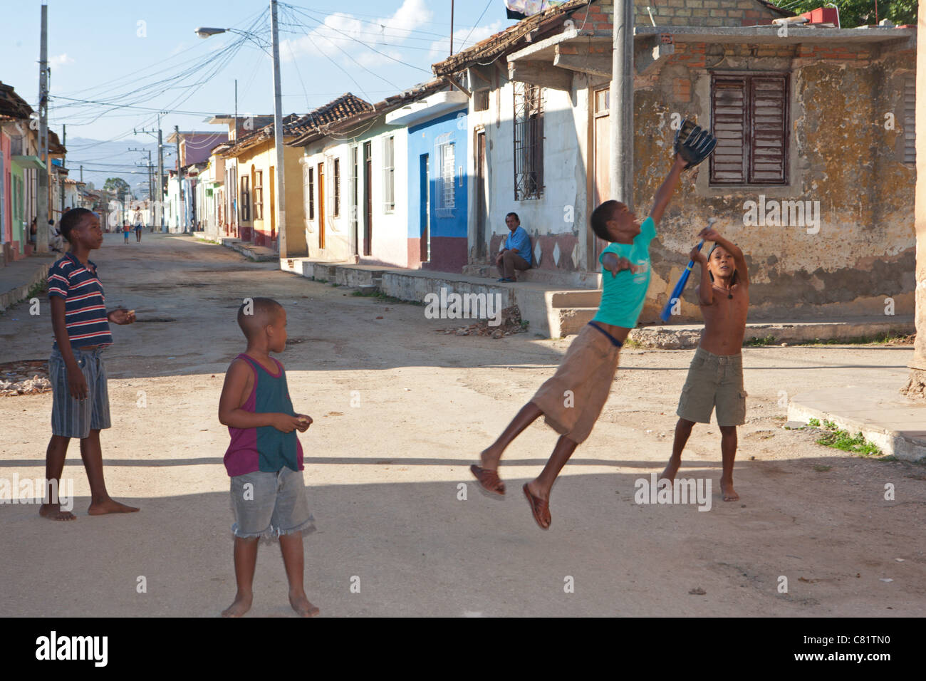 TRINIDAD: BOYS PLAYING BASEBALL IN THE STREET Stock Photo - Alamy