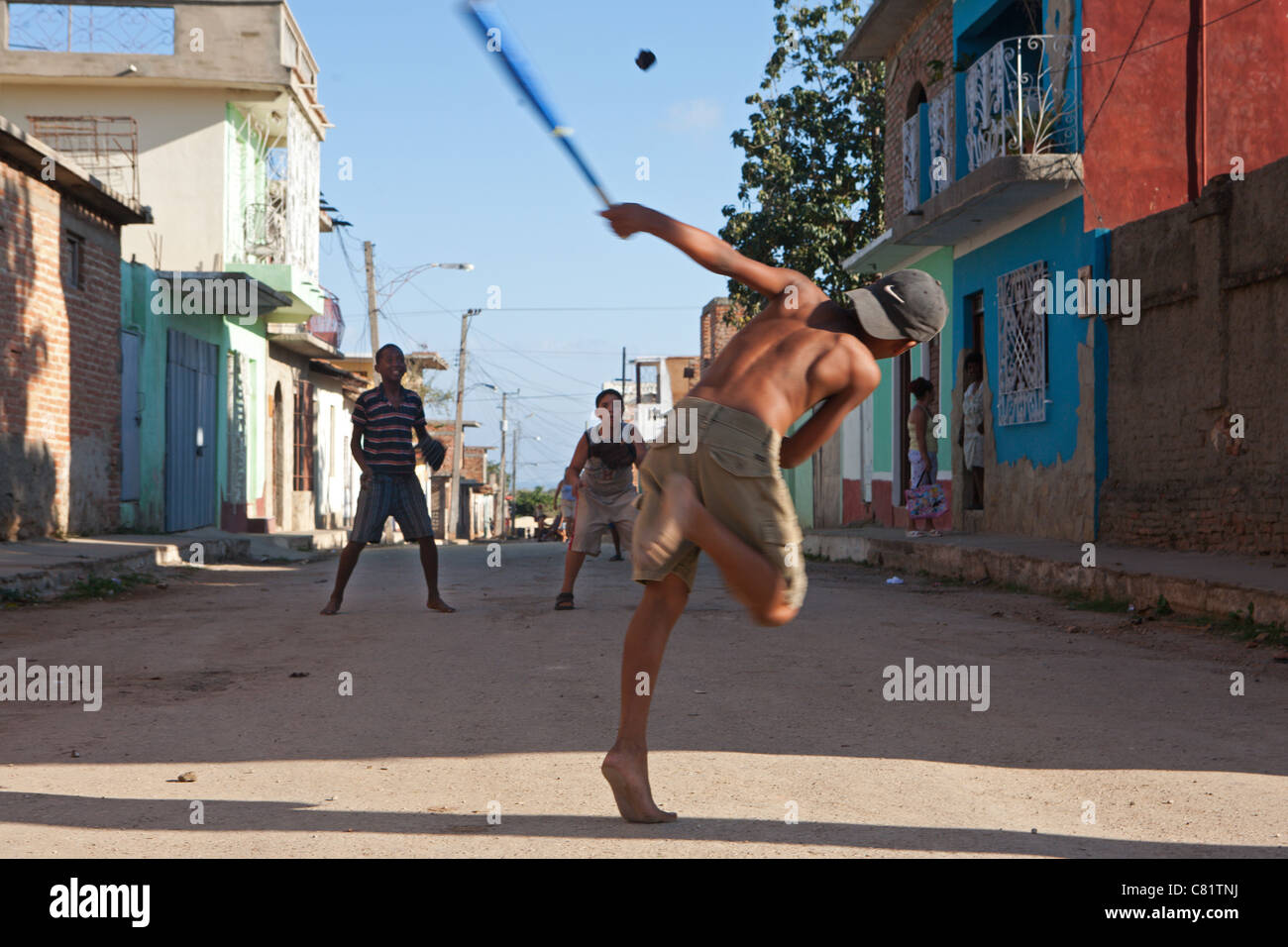 TRINIDAD: BOYS PLAYING BASEBALL IN THE STREET Stock Photo - Alamy