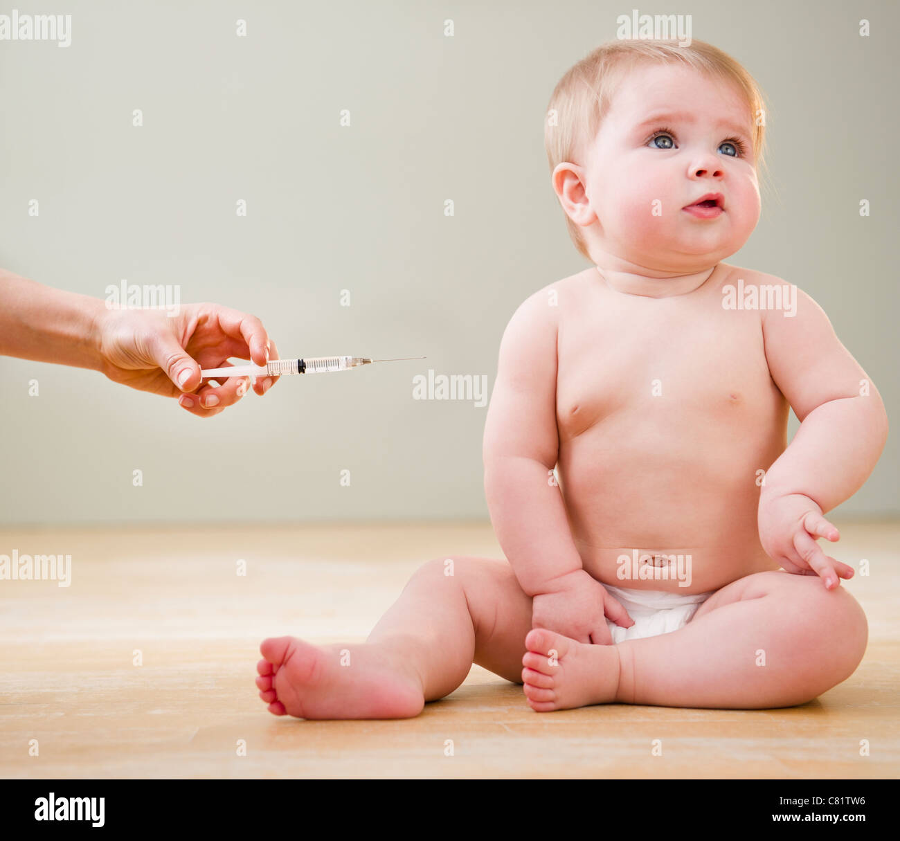 Doctor giving Caucasian baby injection Stock Photo - Alamy