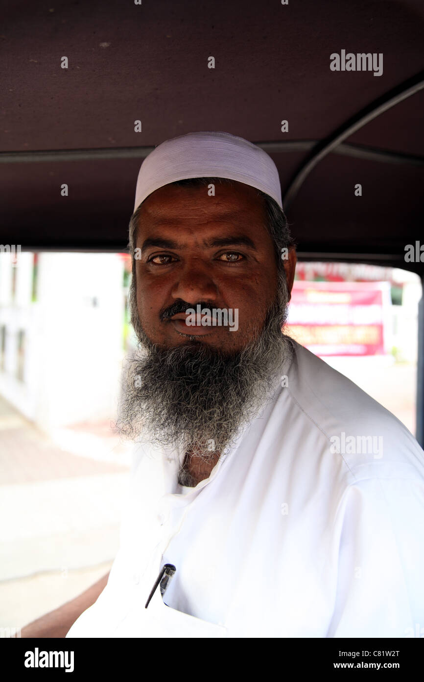 Portrait of bearded Muslim man - an autorickshaw driver - wearing ...