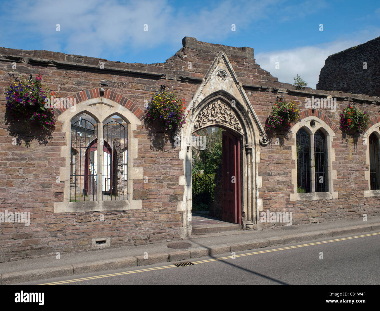The outside of the ruined walls of Druid's Hall, now contains St Rumon ...