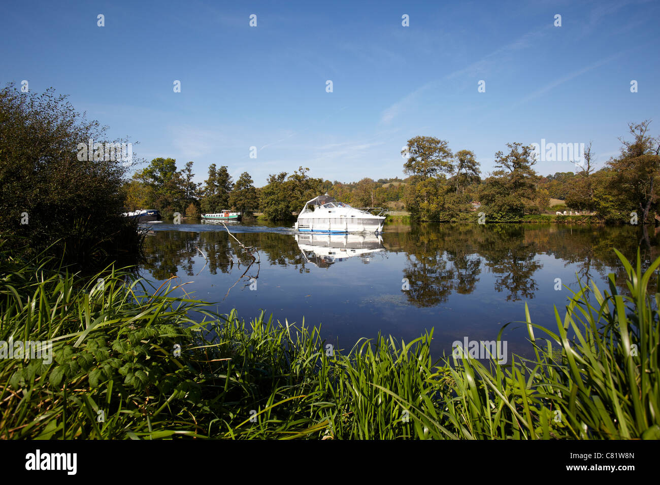 A boat sailing on the River Thames near to Pangbourne, Reading ...