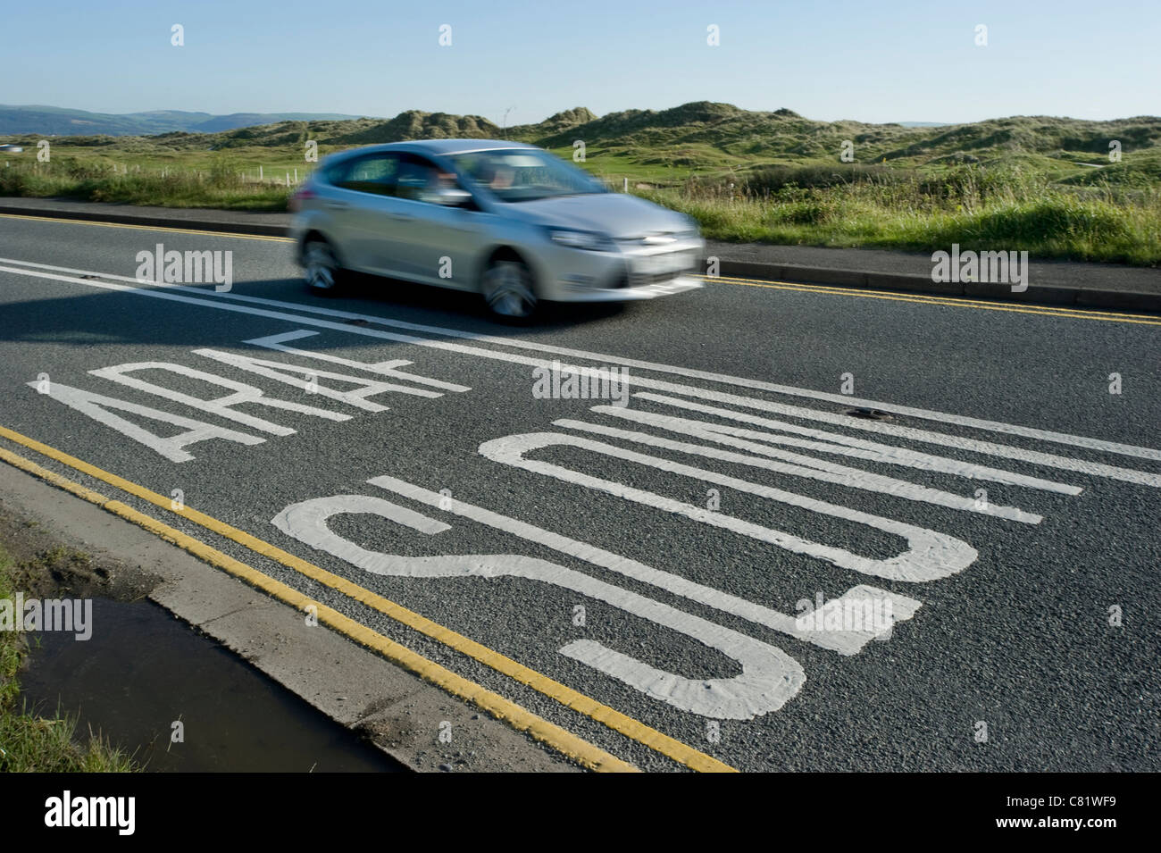 Araf slow road markings in wales hi-res stock photography and images ...