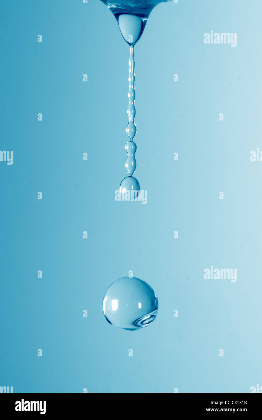 Drop of water frozen in free fall Stock Photo - Alamy