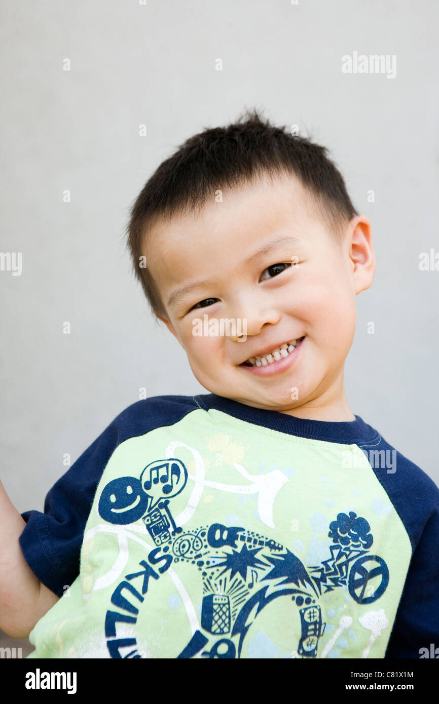 Grinning Chinese boy Stock Photo - Alamy