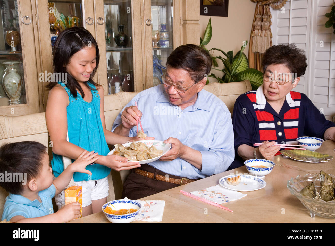 Chinese family eating dumplings hi-res stock photography and images - Alamy