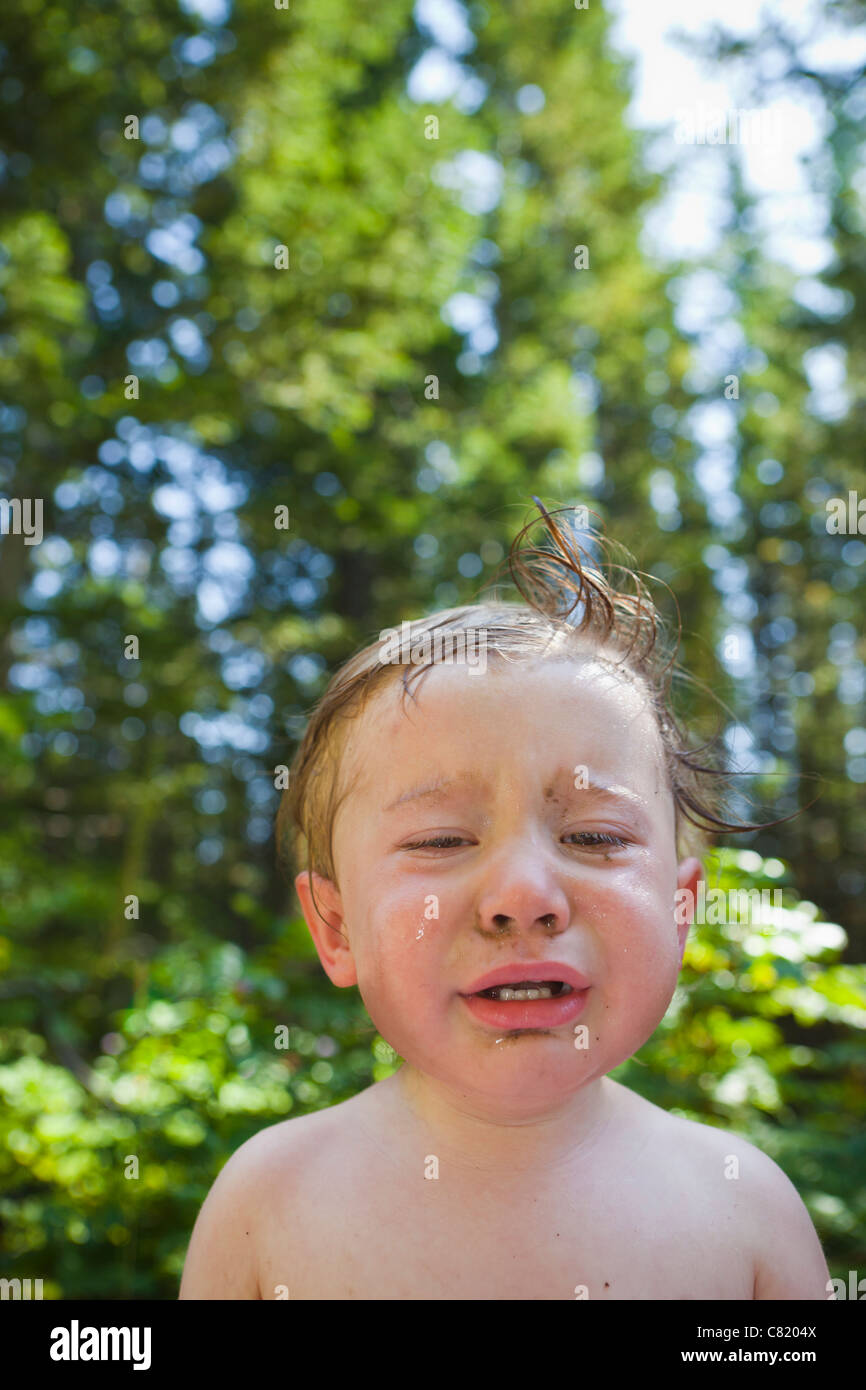 Boy crying outdoors Stock Photo - Alamy
