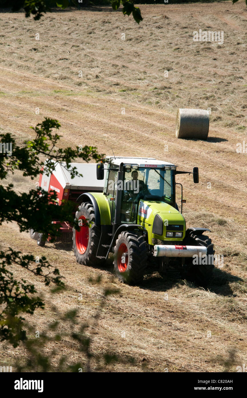 Tractor baling hay hi-res stock photography and images - Alamy