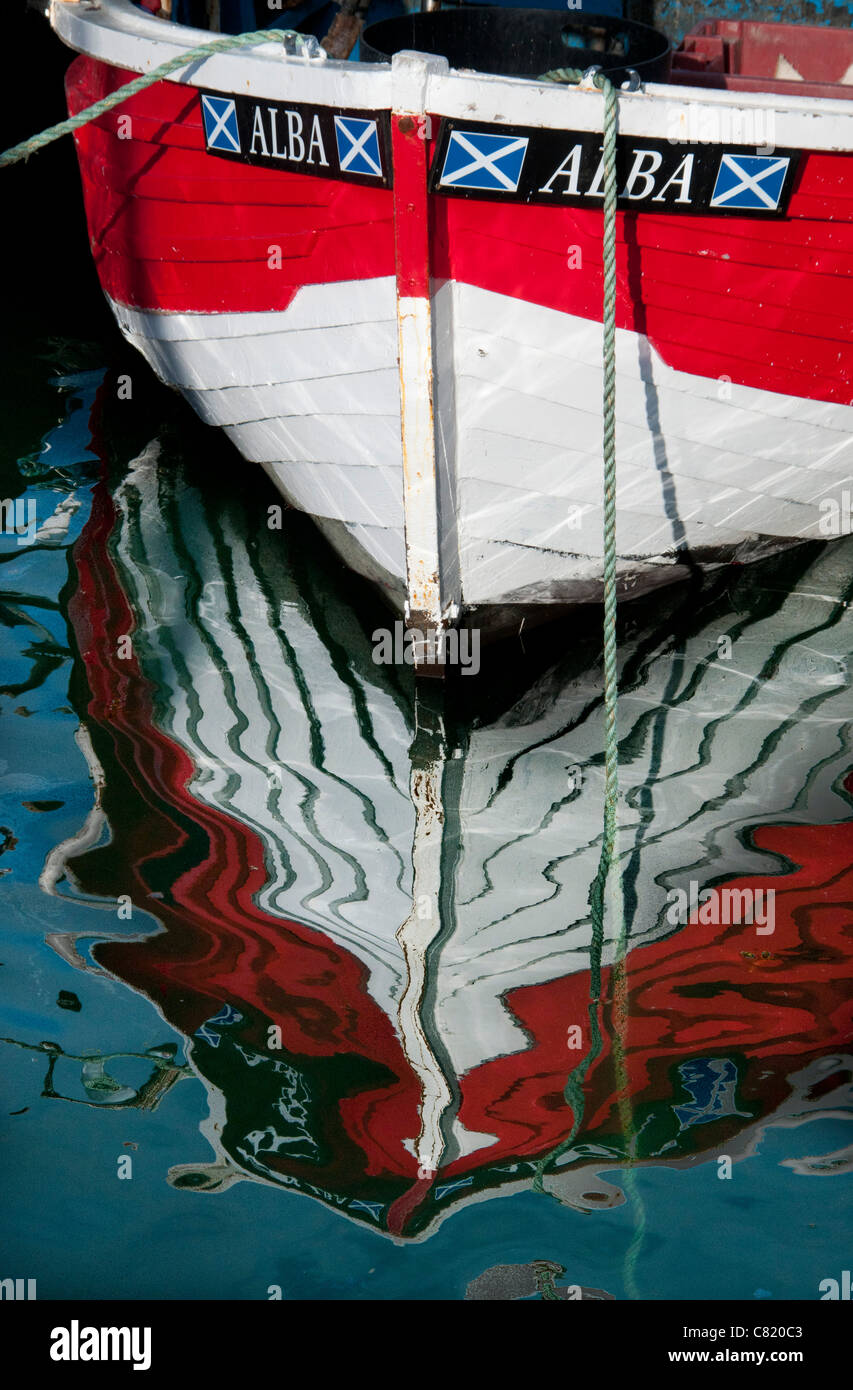 Reflection of the Alba a fishing boat in Dunbar harbour Stock Photo - Alamy