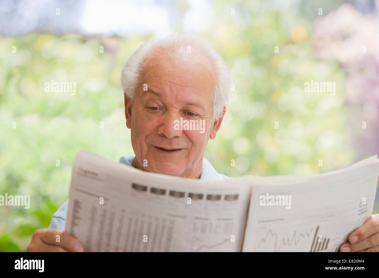 Reading financial newspaper hi-res stock photography and images - Alamy