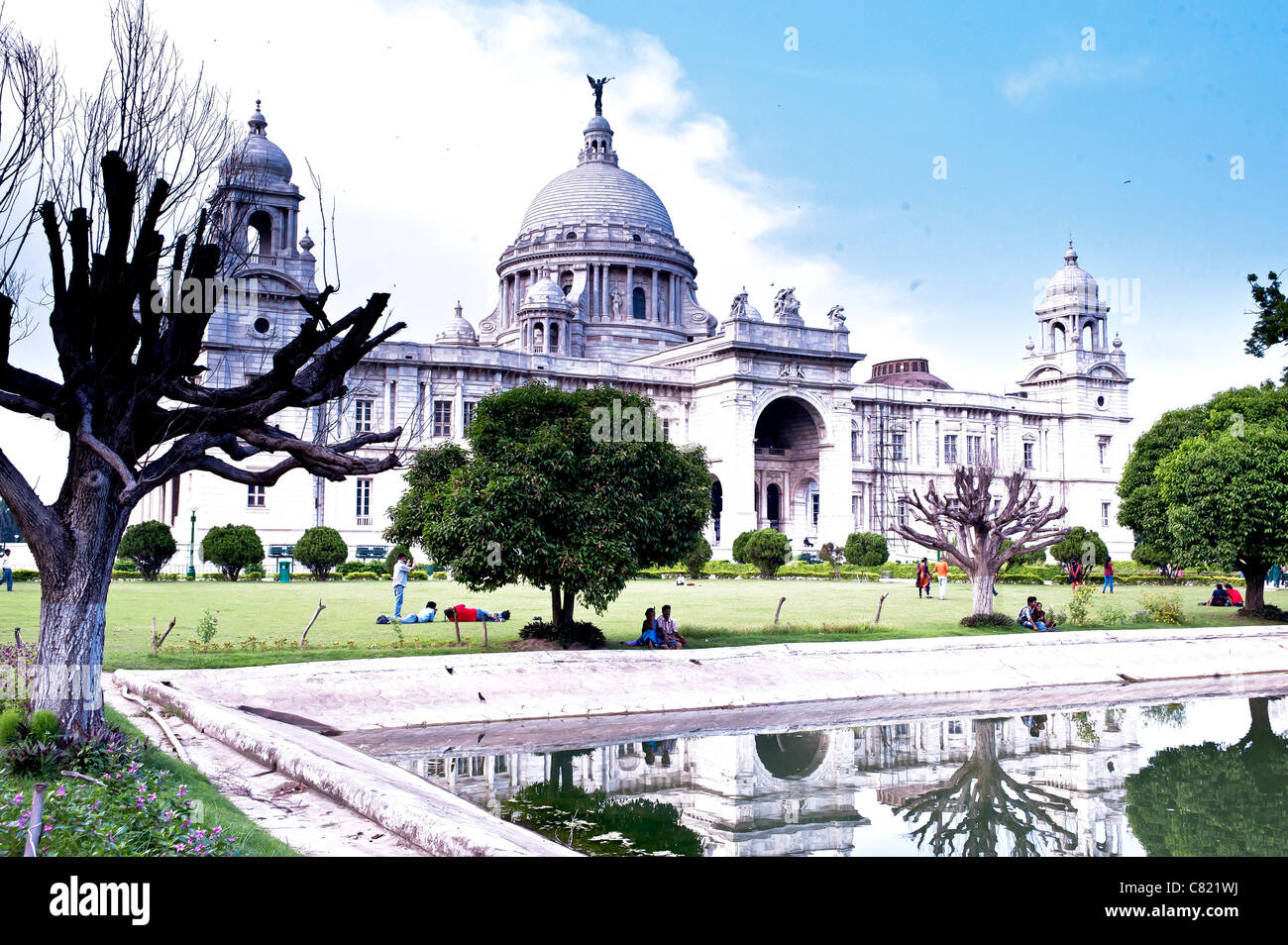 Landscape of Victoria Memorial reflected in the lake water under white ...