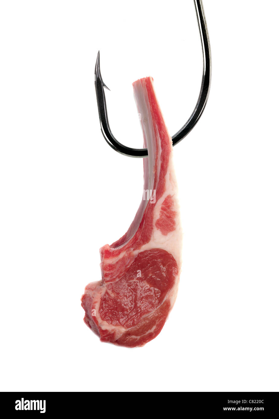 A lamb chop on a hook isolated against a white background Stock Photo ...