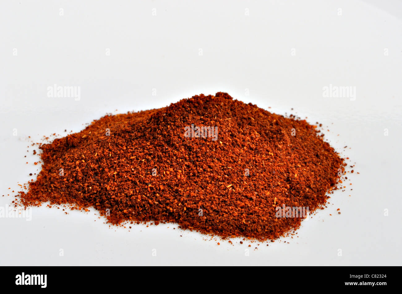 A small pile of Paprika sits on a plain white background Stock Photo ...
