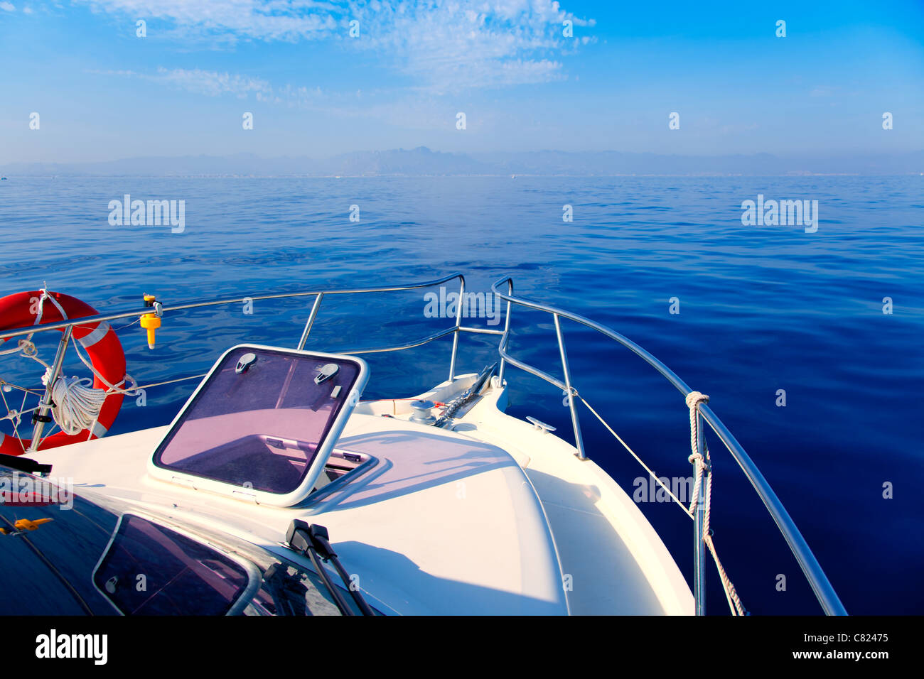 Blue sea boat sailing with open bow porthole in summer vacations Stock ...