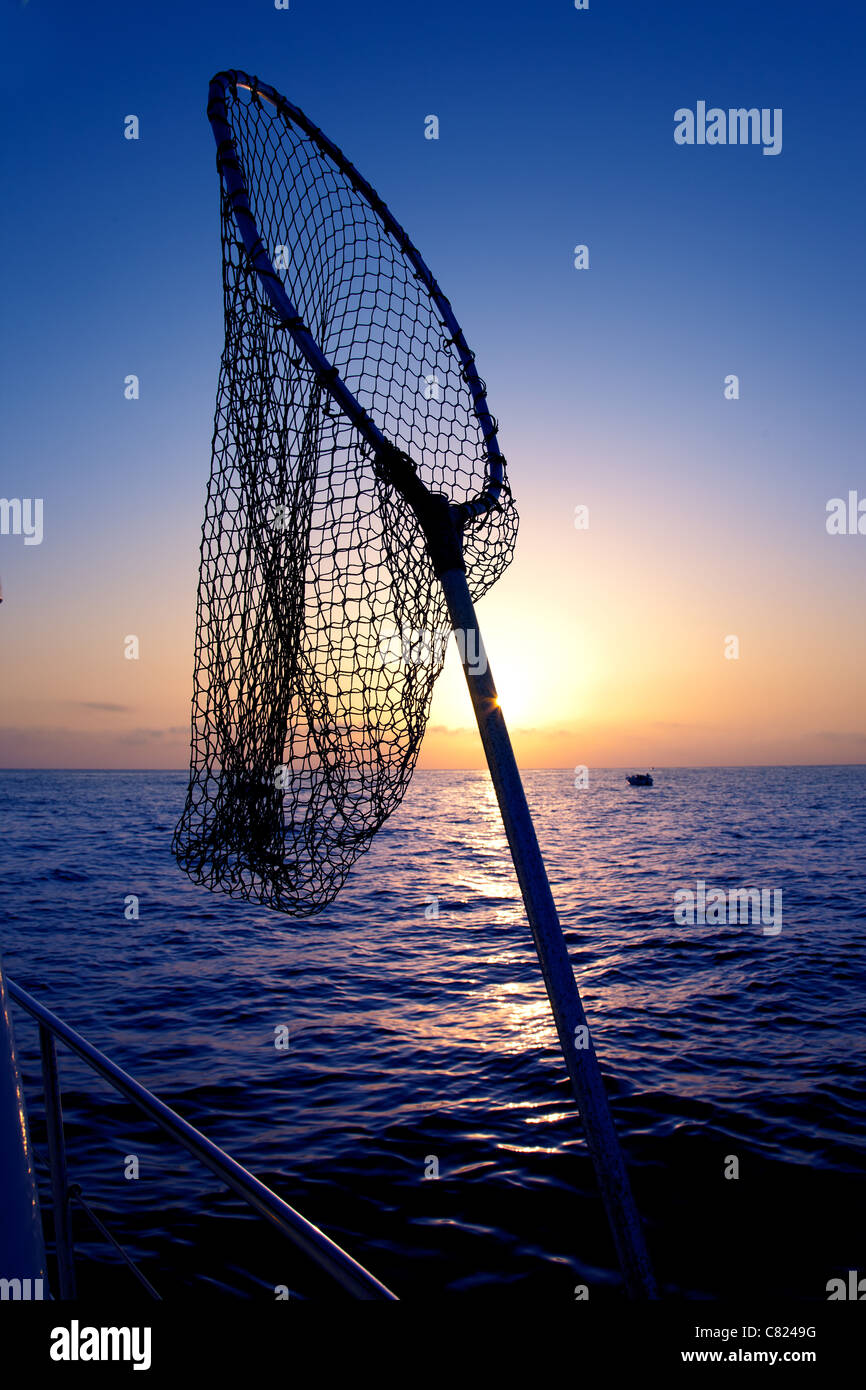 dip net in boat fishing on sunrise water horizon Stock Photo - Alamy