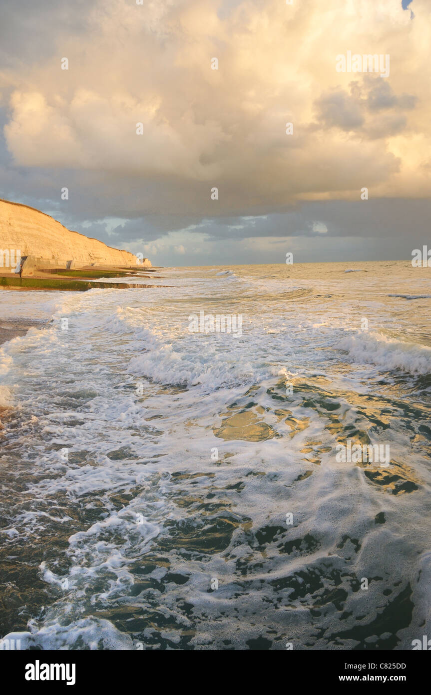 The sea at dramatic sunset, Chalk cliffs and the Undercliff walk ...