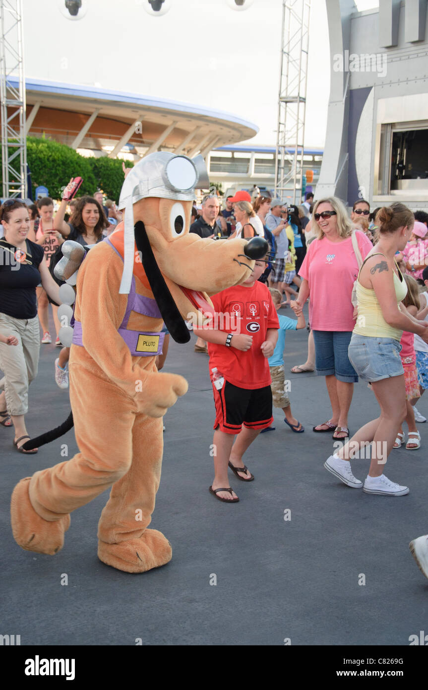 magic kingdom street party with pluto and guests Stock Photo - Alamy
