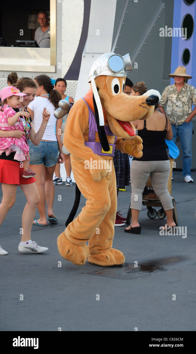 magic kingdom street party with pluto and guests Stock Photo - Alamy