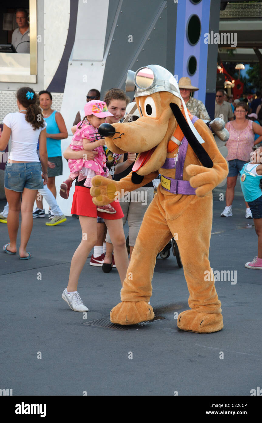magic kingdom street party with pluto and guests Stock Photo - Alamy