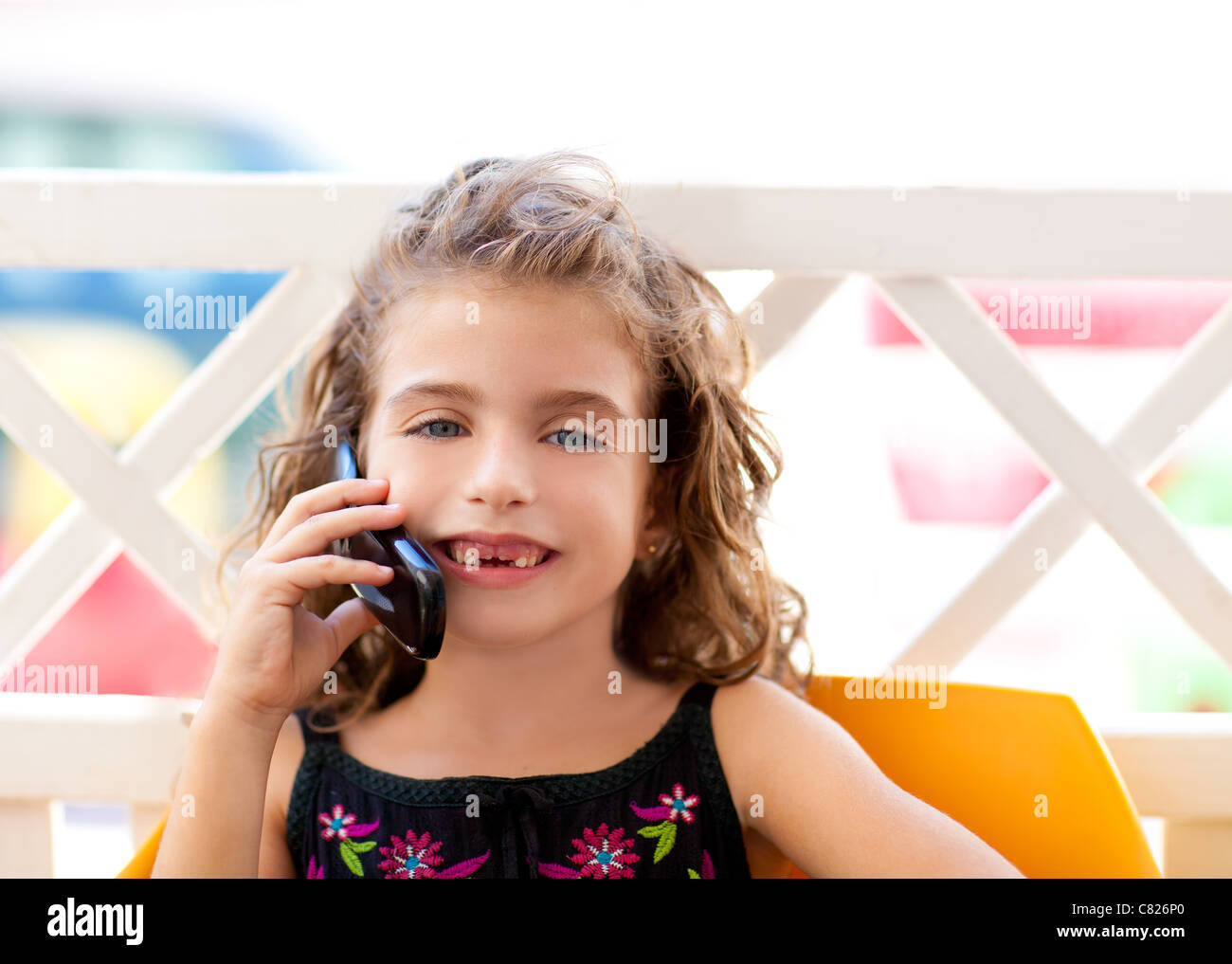 children kid girl talking mobile phone indented smiling Stock Photo - Alamy