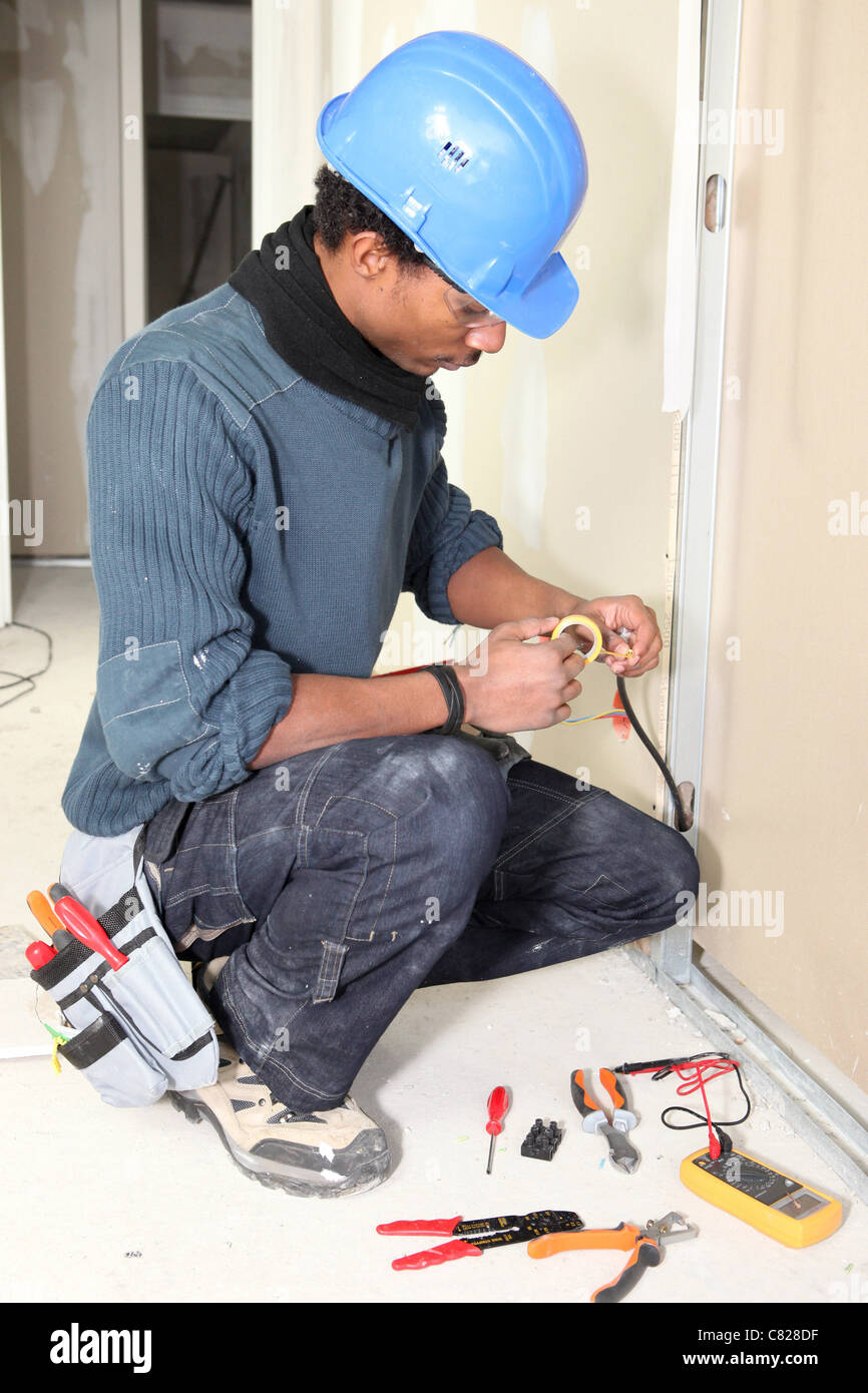 Electrician taping a wire Stock Photo - Alamy