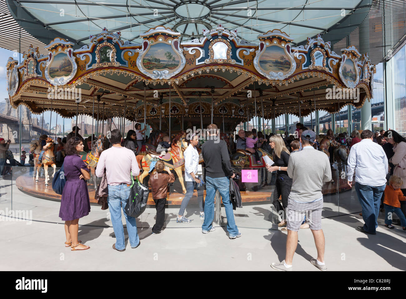 People visit historic Jane's Carousel in Brooklyn Bridge Park in the ...