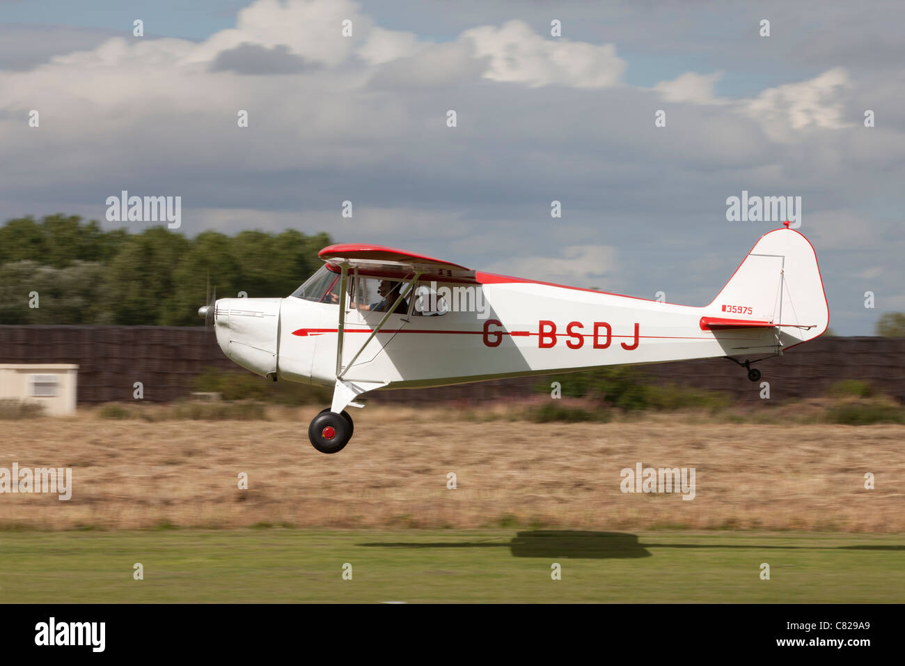 Piper J4E Cub Coupe G-BSDJ taking-off from breighton Airfield Stock ...