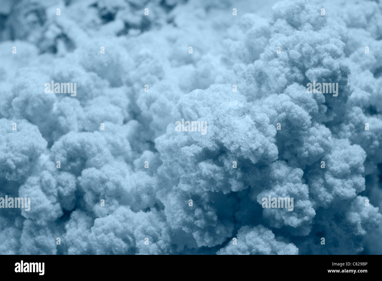 full frame abstract blooming background with salt crystals, blue toned ...