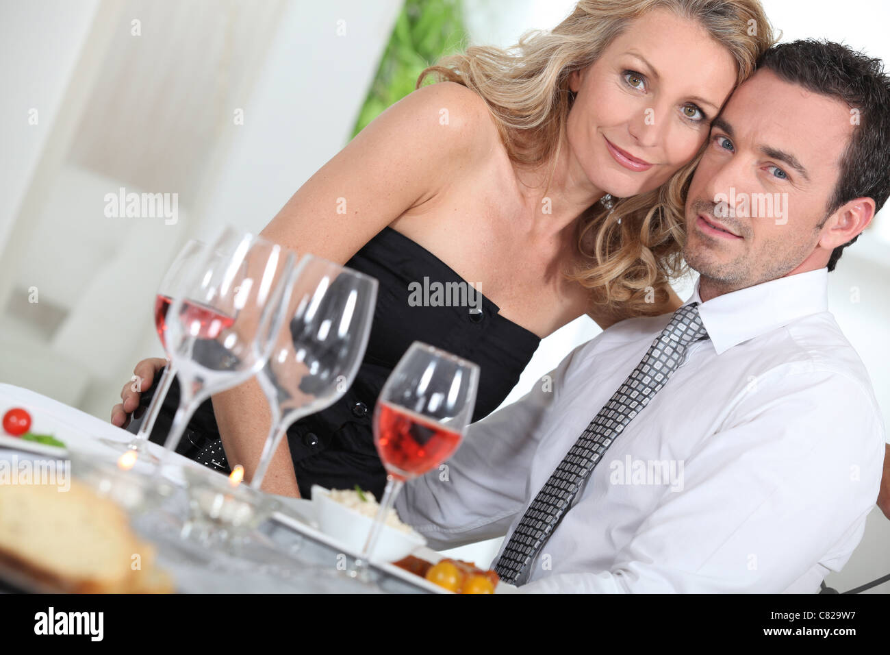 Dinner guests at the table Stock Photo - Alamy