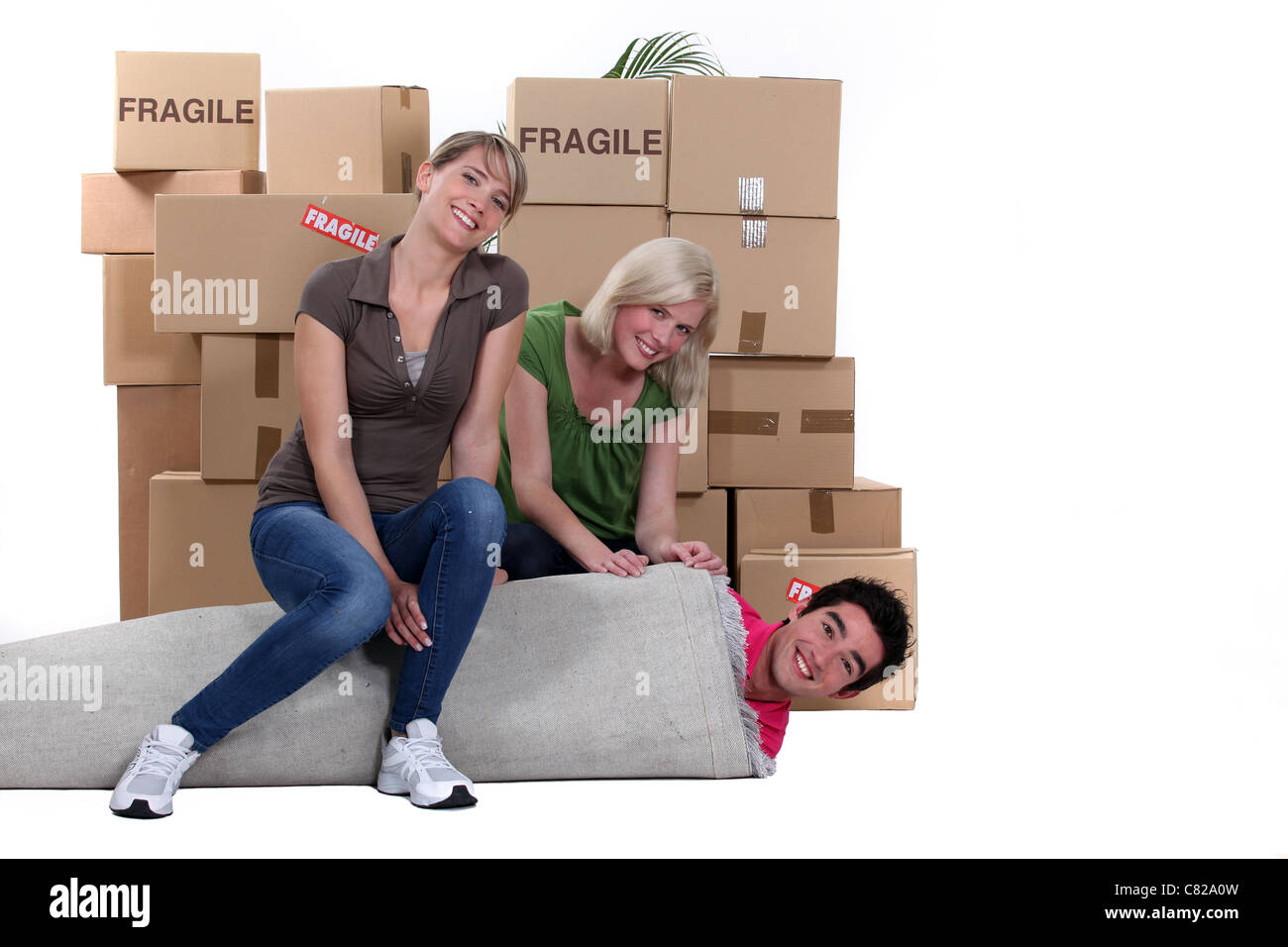 Happy friends moving Stock Photo - Alamy