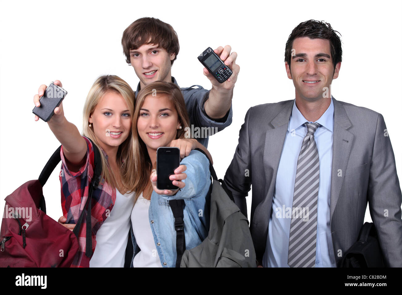 Teenagers showing phones Stock Photo - Alamy