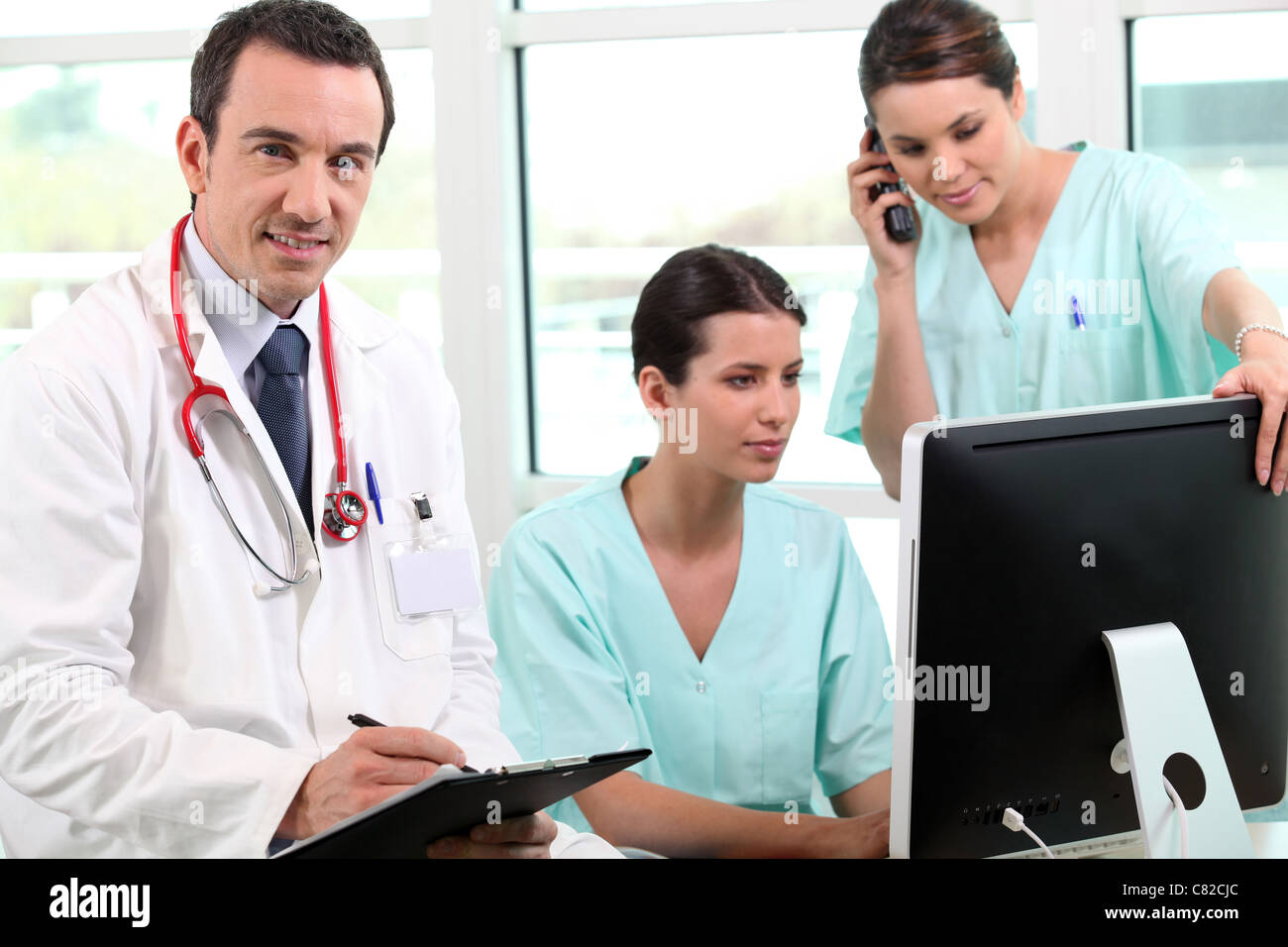 General practitioner and nurses Stock Photo - Alamy