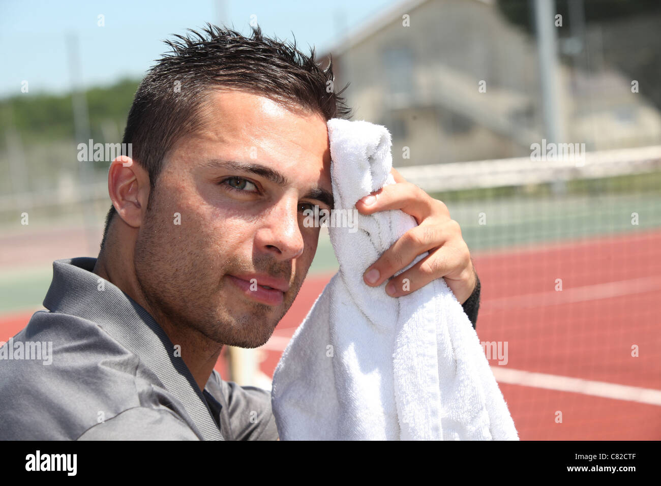 tennis player with towel Stock Photo - Alamy