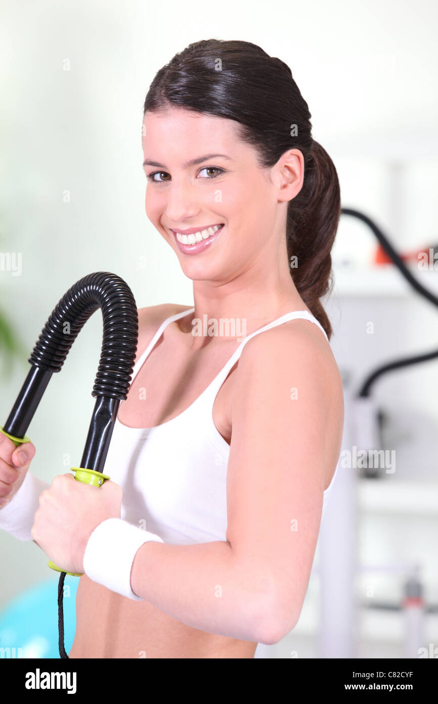 Woman toning her muscles at the gym Stock Photo - Alamy