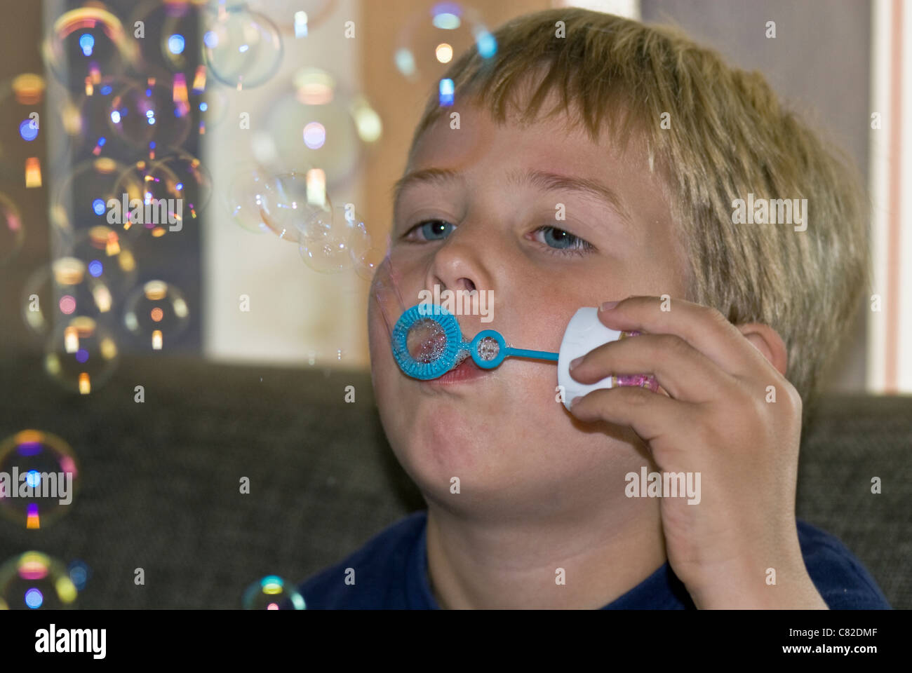 Soap bubble blowing Young Little Blond Boy Stock Photo - Alamy