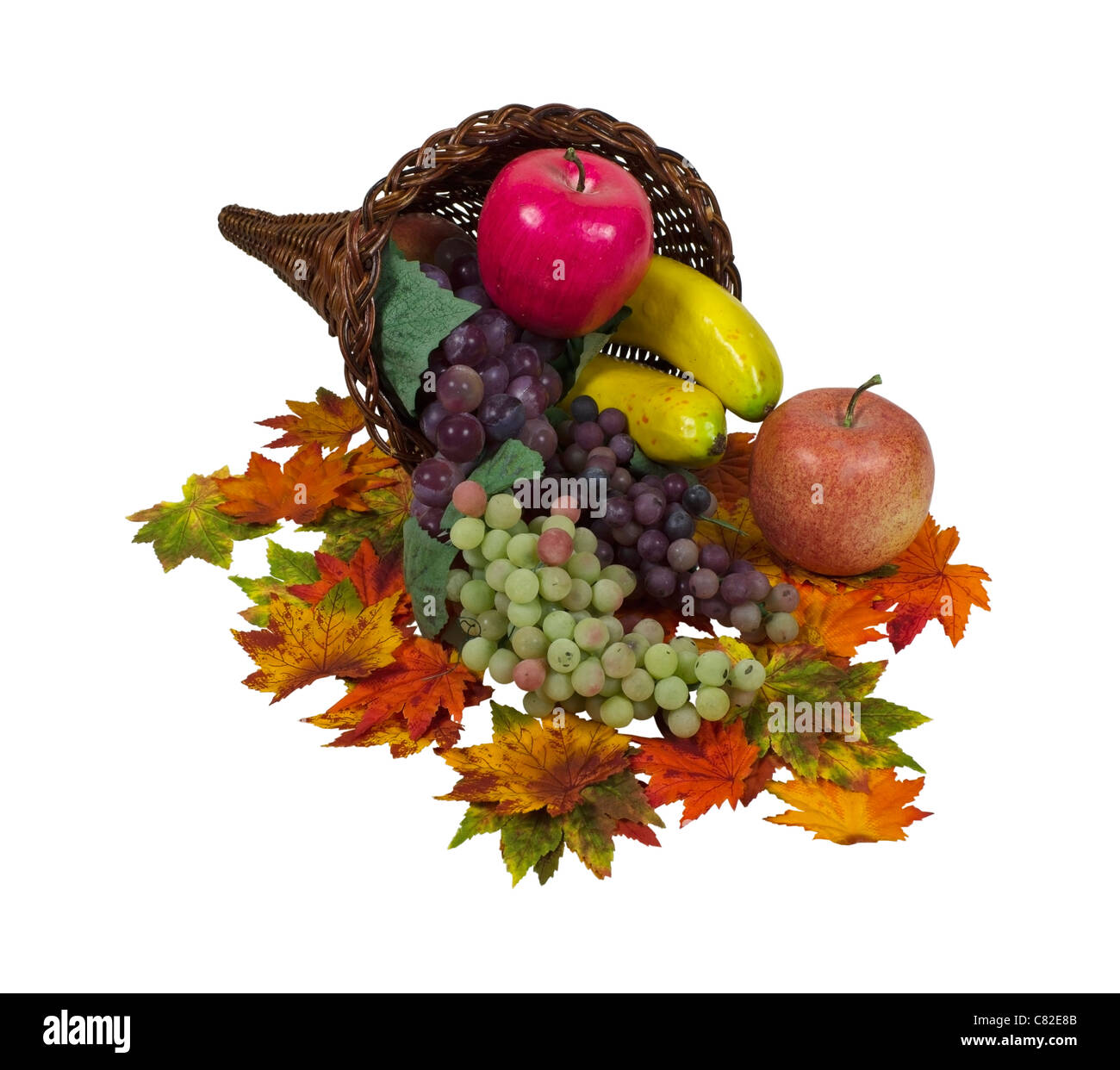 Cornucopia of abundant fruit garnished with leaves - path included ...