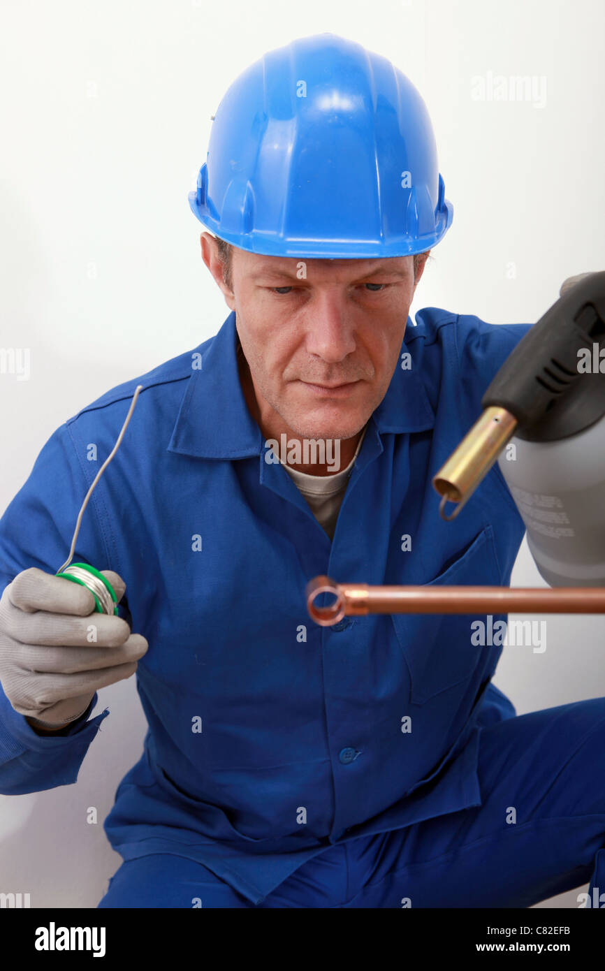 Worker using a blowtorch Stock Photo - Alamy