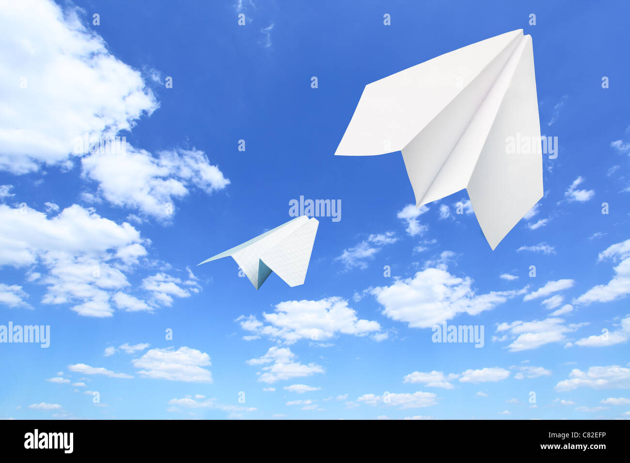 Planes flying high in blue hi-res stock photography and images - Alamy