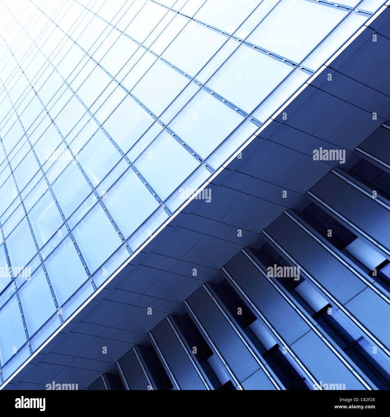 Windows of modern building toned in blue color Stock Photo - Alamy