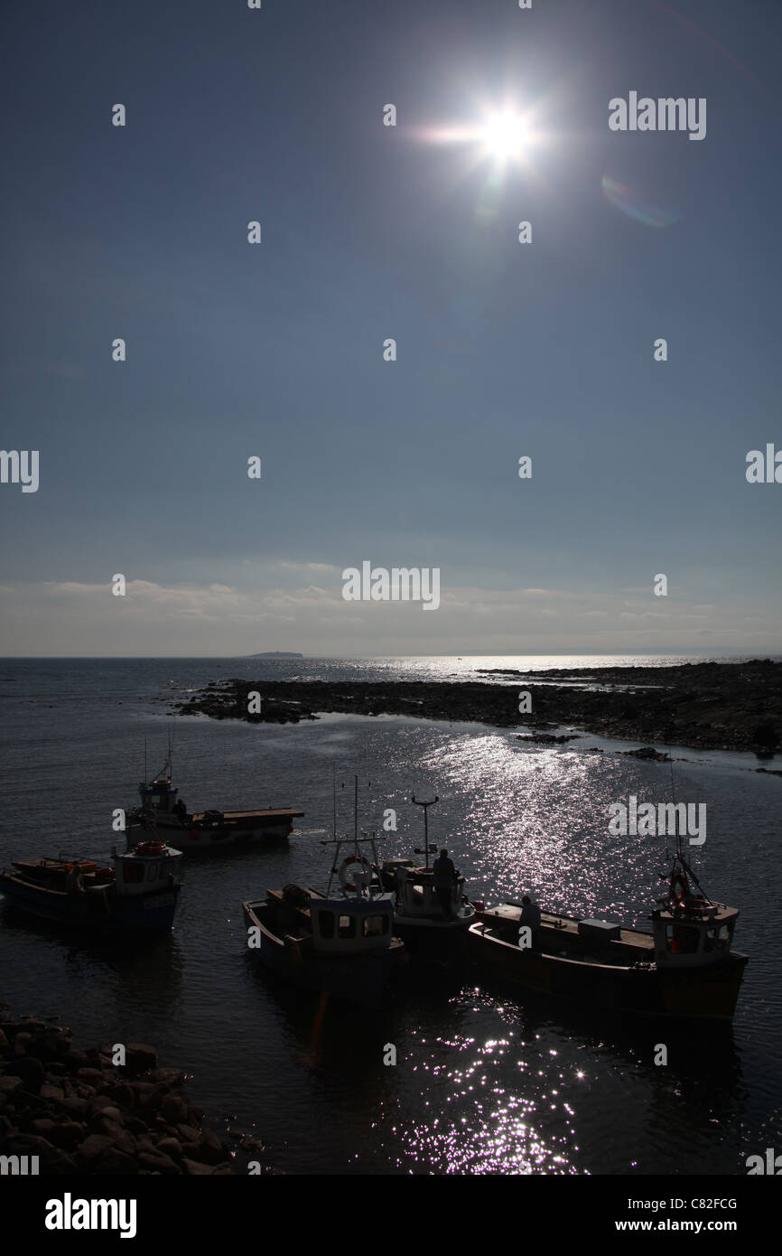 Town of Crail, Scotland. Silhouetted view of fishing boats waiting for ...