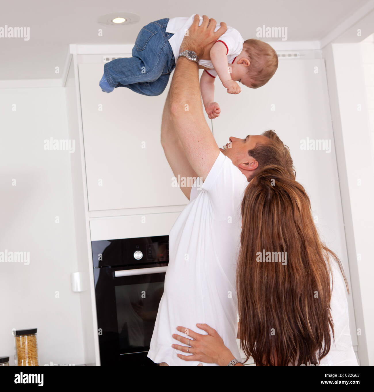 Mom throwing baby in air hi-res stock photography and images - Alamy